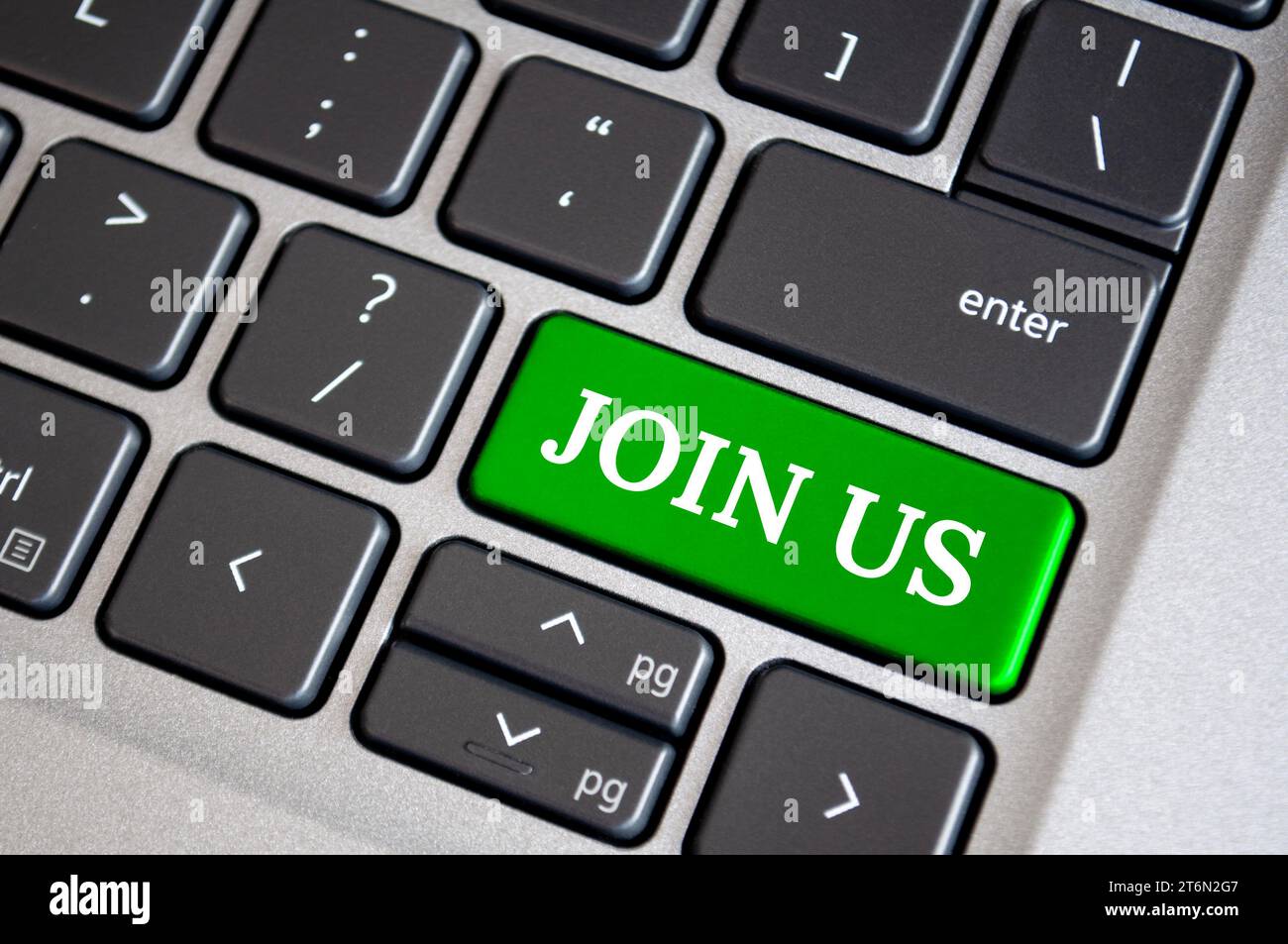 Join us text on green color keyboard Stock Photo - Alamy