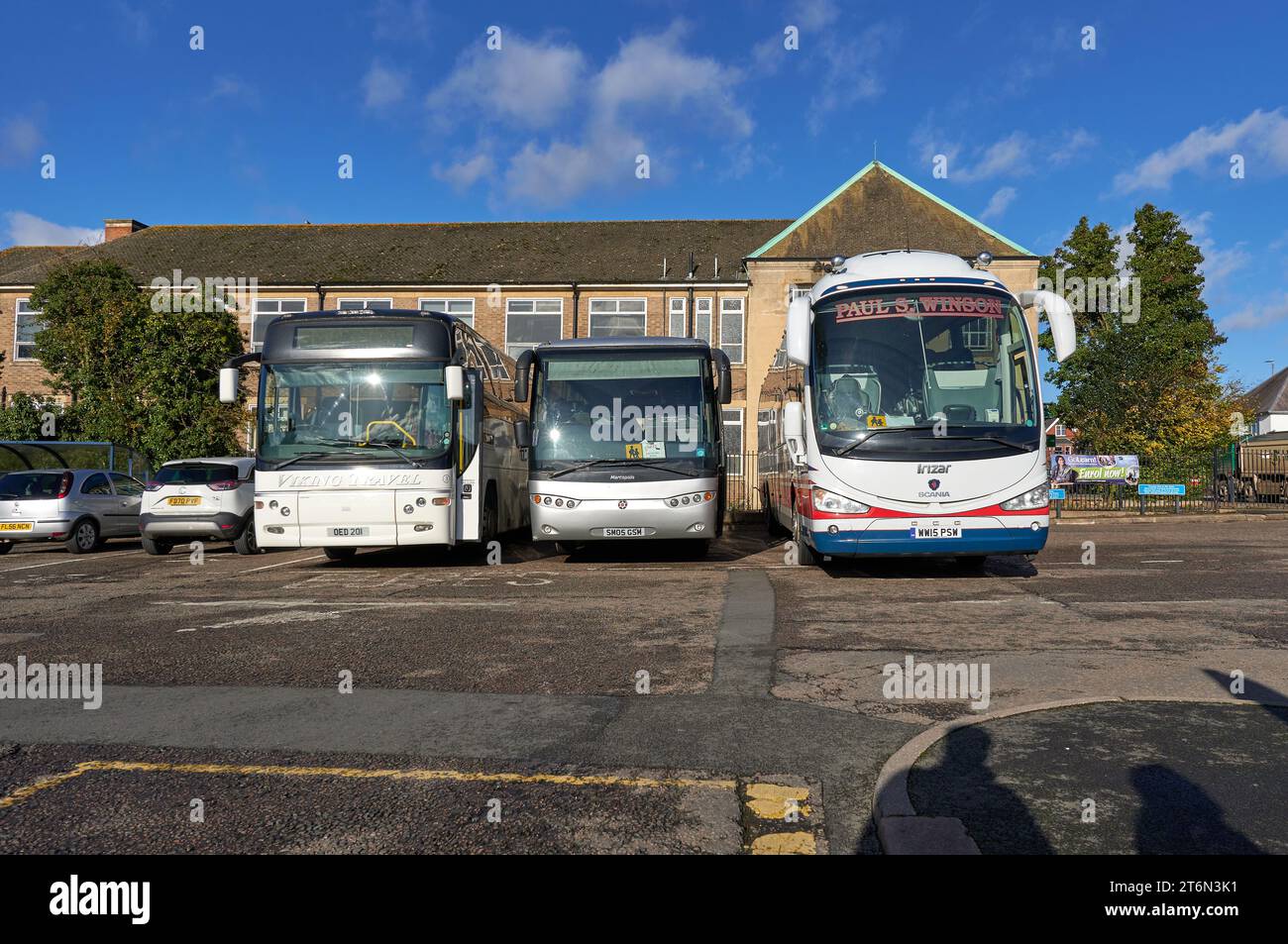 Three tour coaches in a car park in Melton Mowbray, UK Stock Photo - Alamy