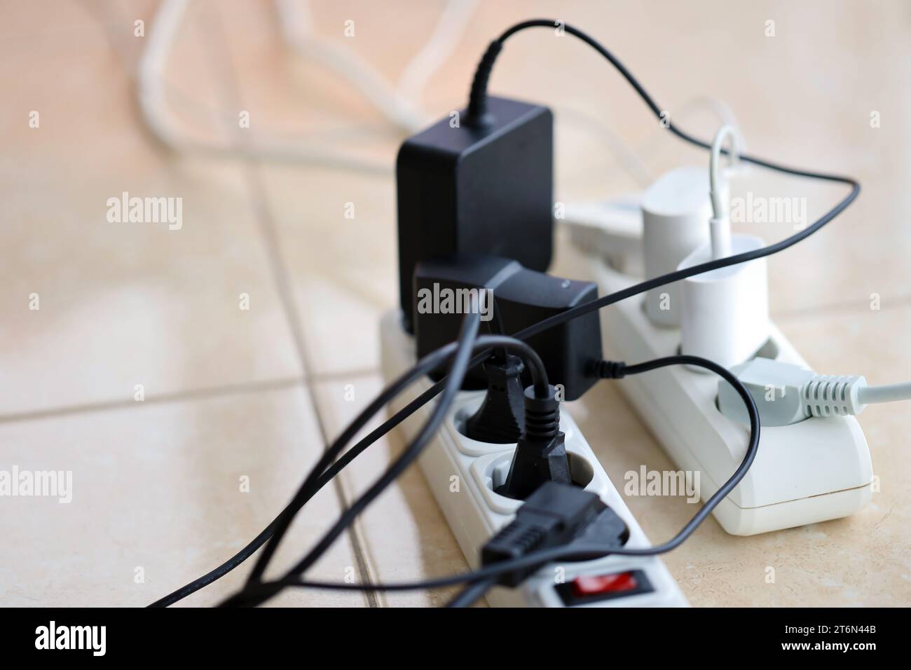 Overloaded power boards. Power strips with different electrical plugs ...