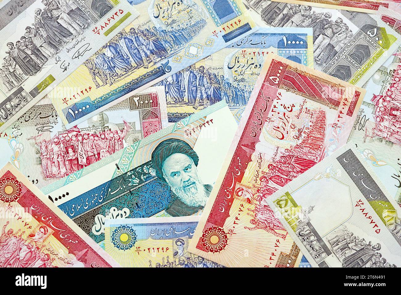 Big pile of Iranian Rial IRR banknotes from Iran as the background on ...