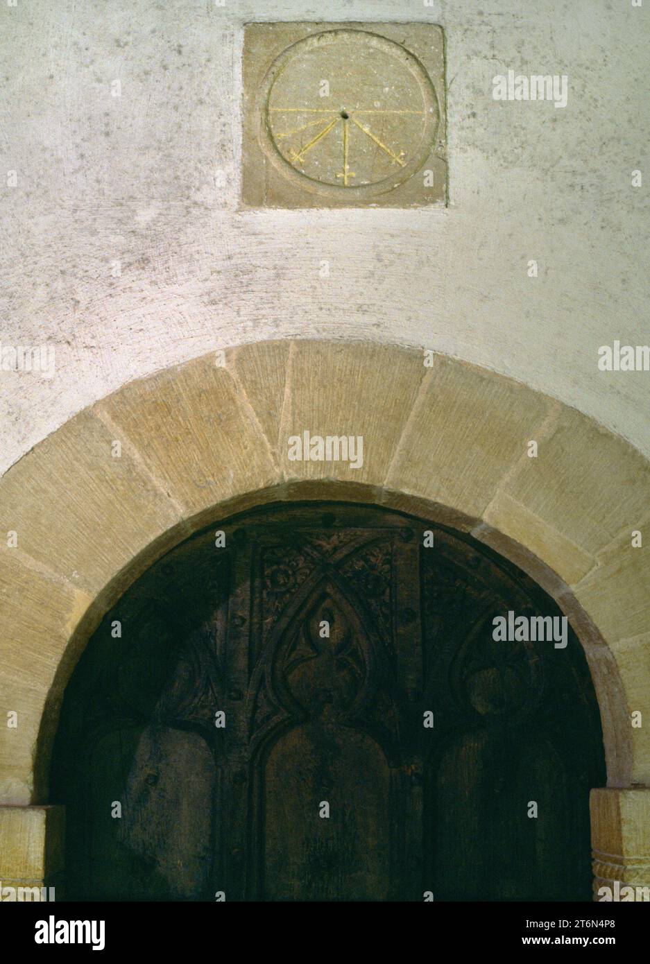 Anglo-Saxon scratch dial above the C11th south door of Holy Rood Church ...