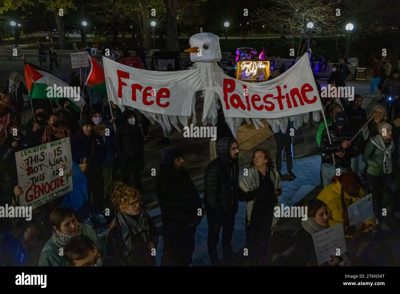 NEW YORK, NEW YORK - NOVEMBER 10: Protesters march with a giant puppet ...