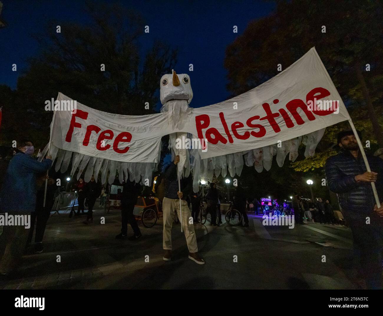 NEW YORK, NEW YORK - NOVEMBER 10: Protesters march with a giant puppet ...