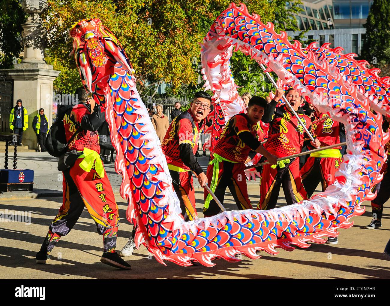 London, UK 11th Nov 2023. Participants with a Chinese group dragon ...