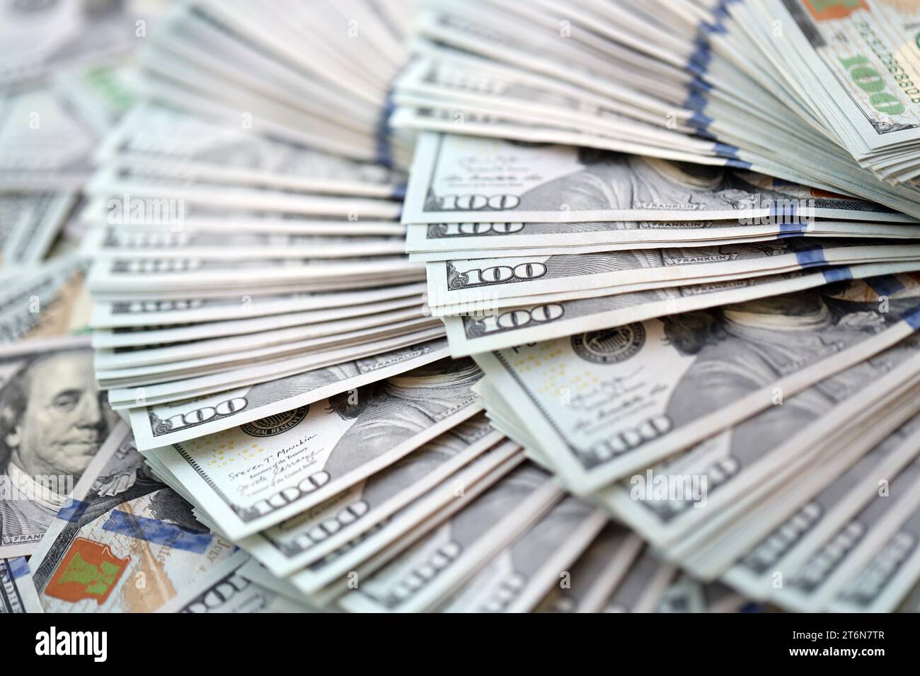 Very big amount of US hundred dollar bills close up. Huge quantity of ...