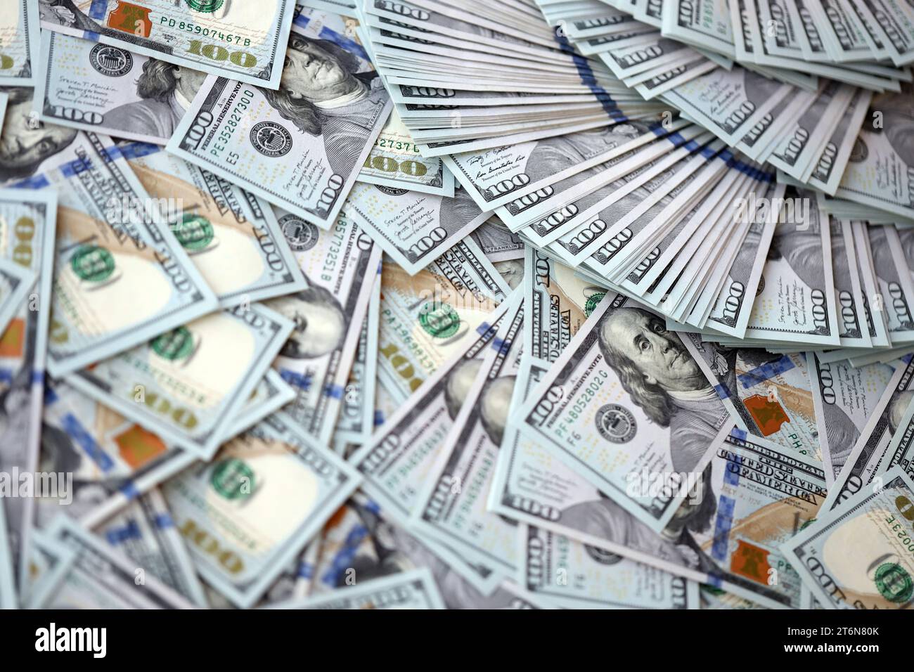 Very big amount of US hundred dollar bills close up. Huge quantity of ...