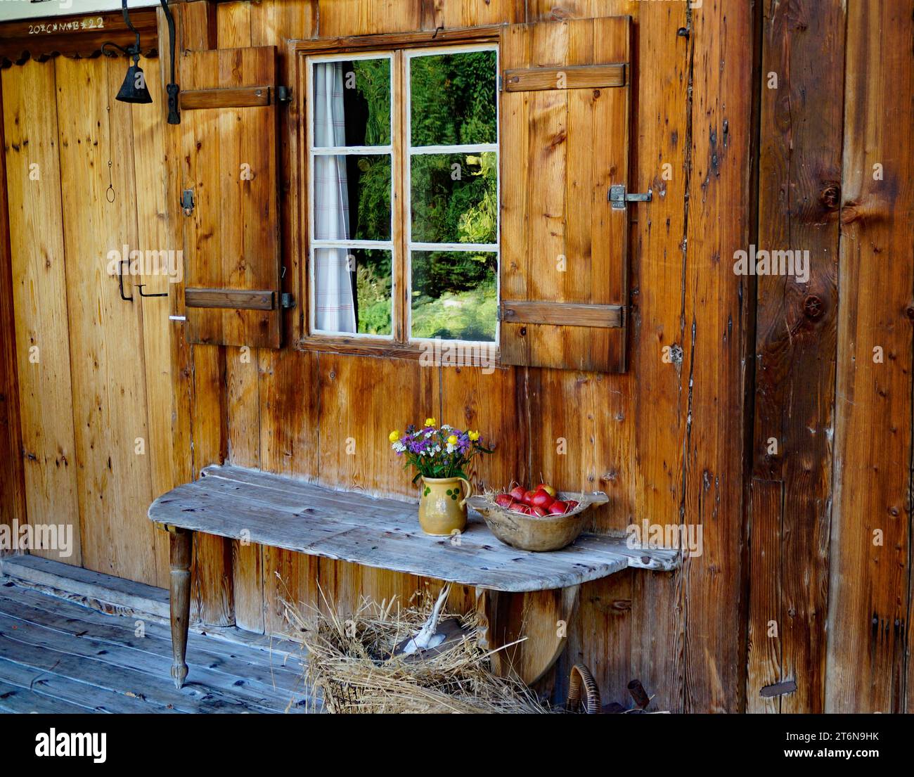 rustic countryside scenery with an old yellow vase with field flowers ...