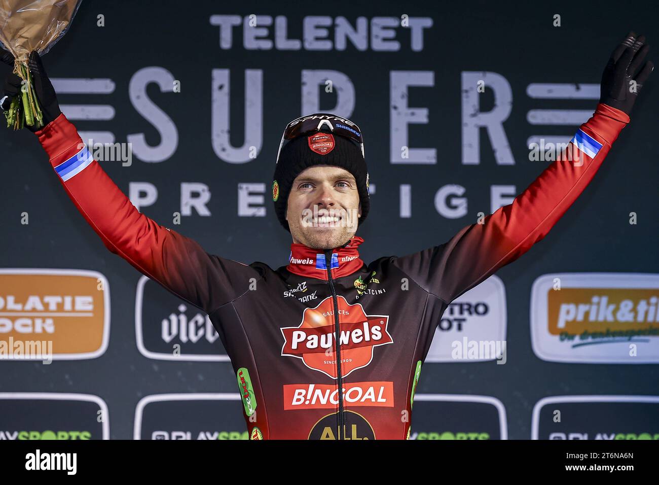 Belgian Eli Iserbyt celebrates on the podium after winning the men's ...