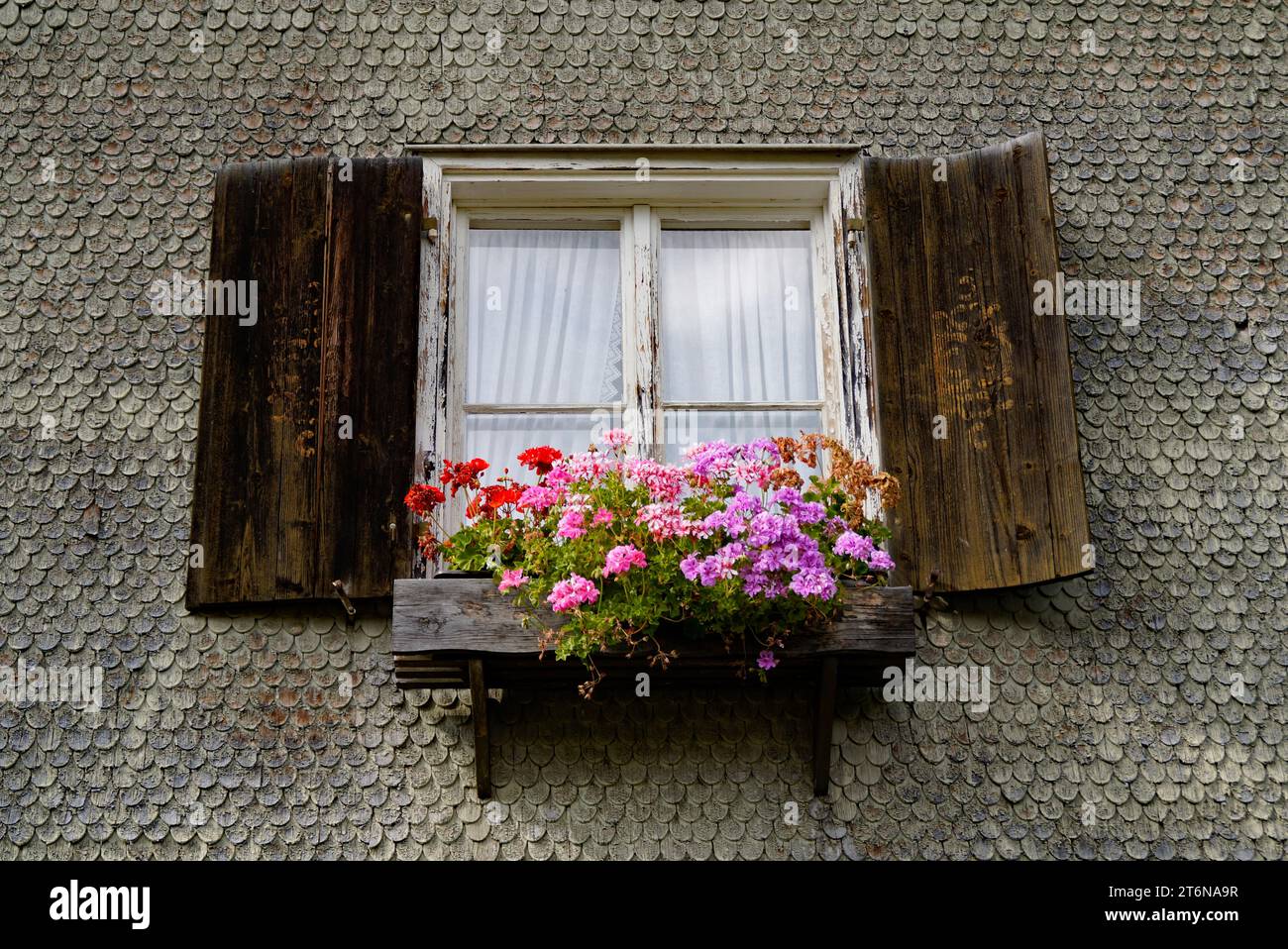traditional Bavarian alpine country house covered with wood shingles ...