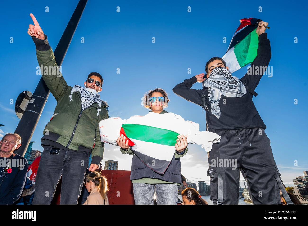 London, UK. 11 Nov 2023. An object is carried in a bloody sheet to ...