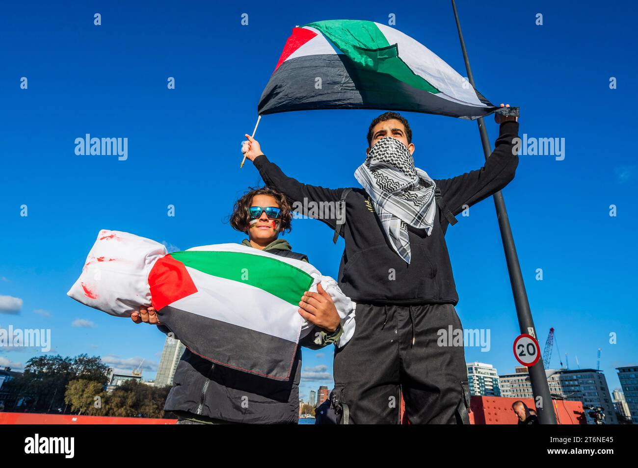 London, UK. 11 Nov 2023. An object is carried in a bloody sheet to ...