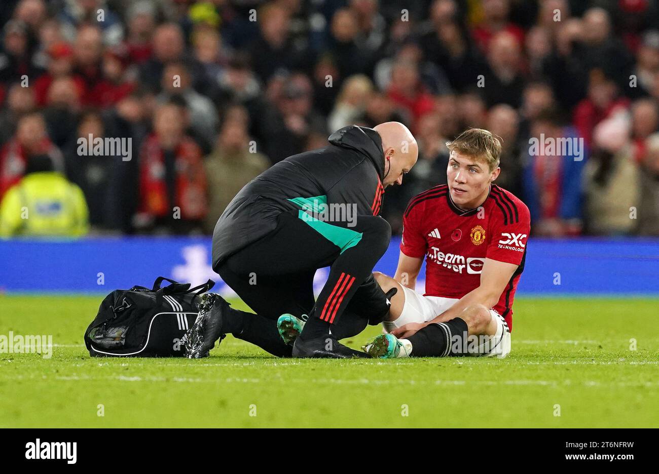 Manchester United's Rasmus Hojlund receives treatment for an injury ...