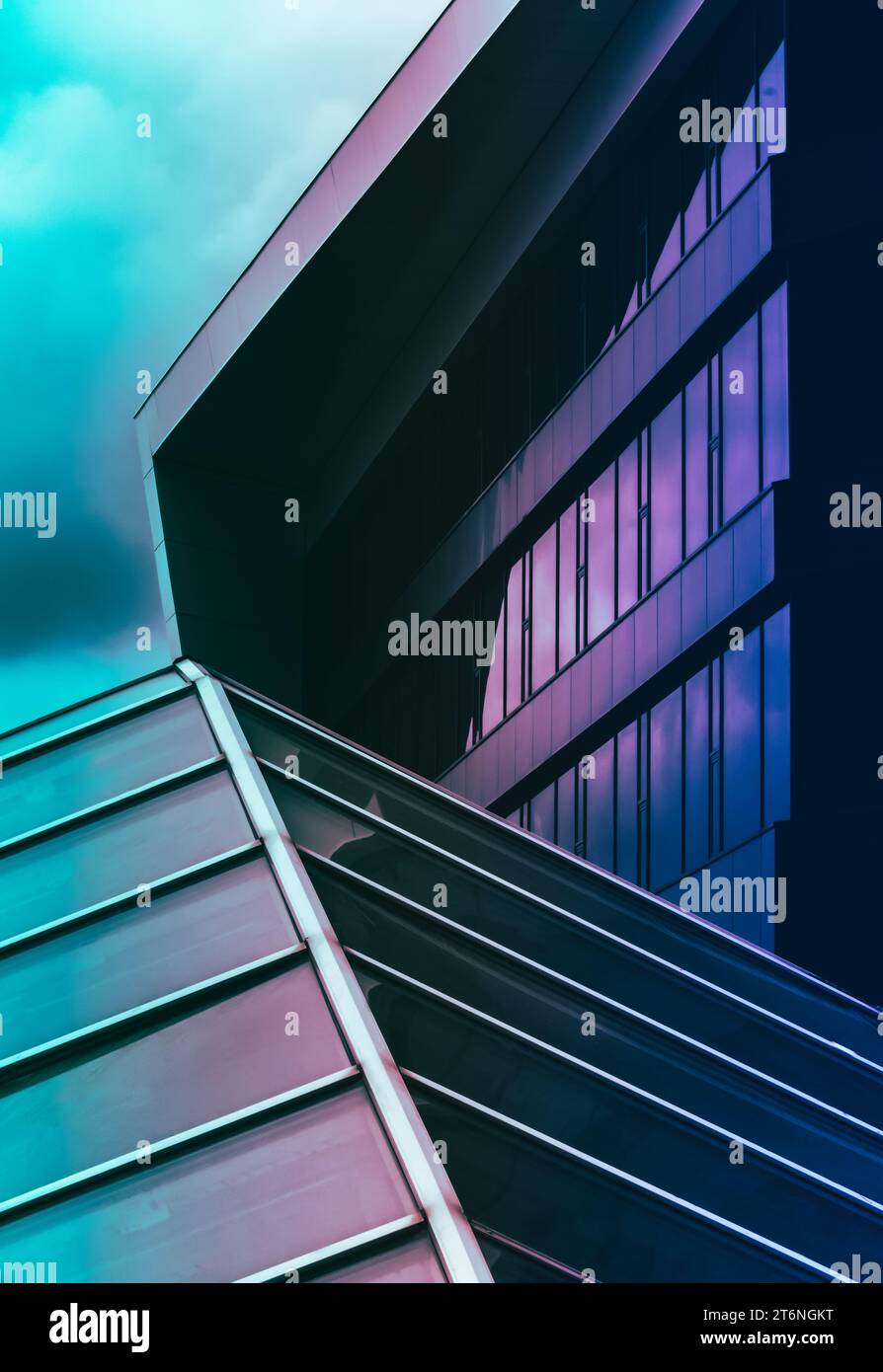 Modern building facade of glass and metal painted with vibrant gradient ...