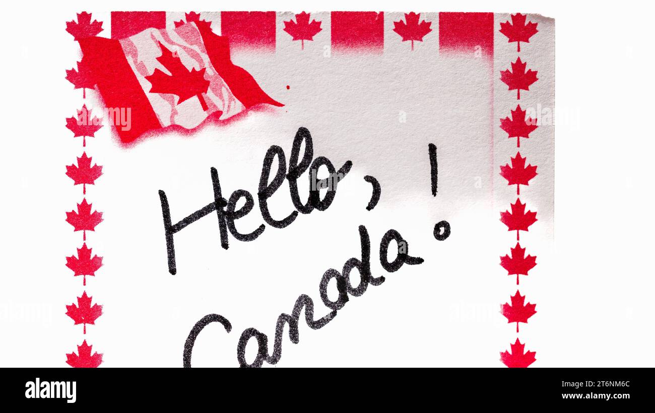 Hello Canada handwriting on paper with Canada flag. Writing text on memo post reminder ...