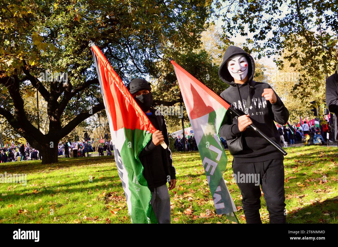two masked young boys; scenes from the mass anti war pro ceasefire ...