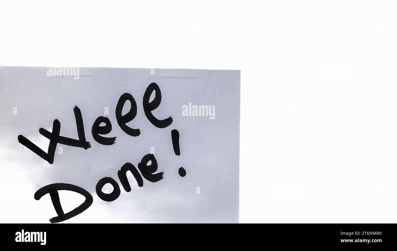 Well done handwriting text close up isolated on white paper with copy ...