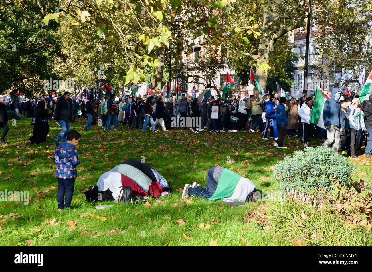 a family breaks for prayer; scenes from the mass anti war pro peace ...