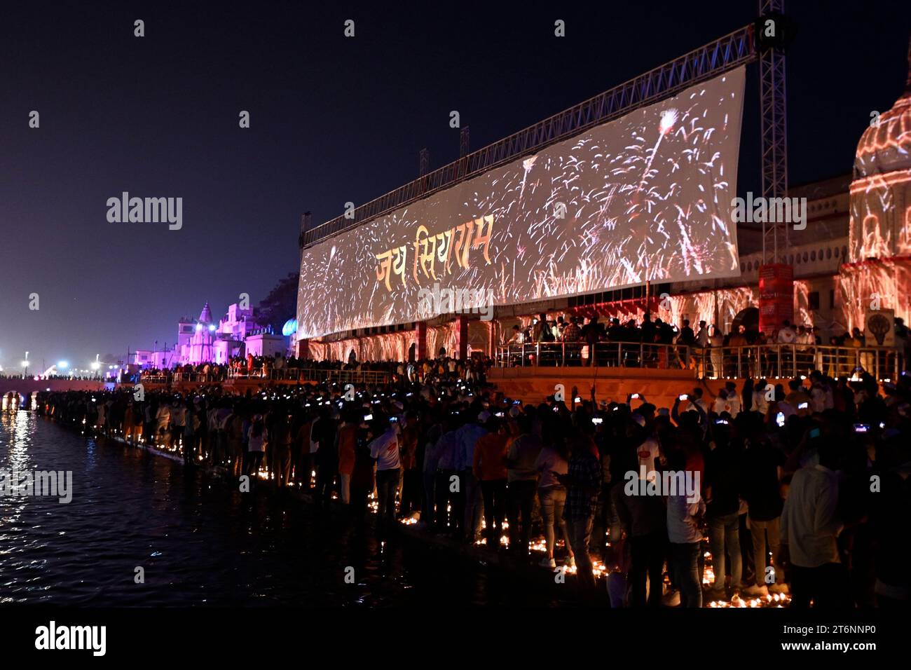AYODHYA, INDIA – NOVEMBER 11: People lighting earthen lamps at Ram ki ...