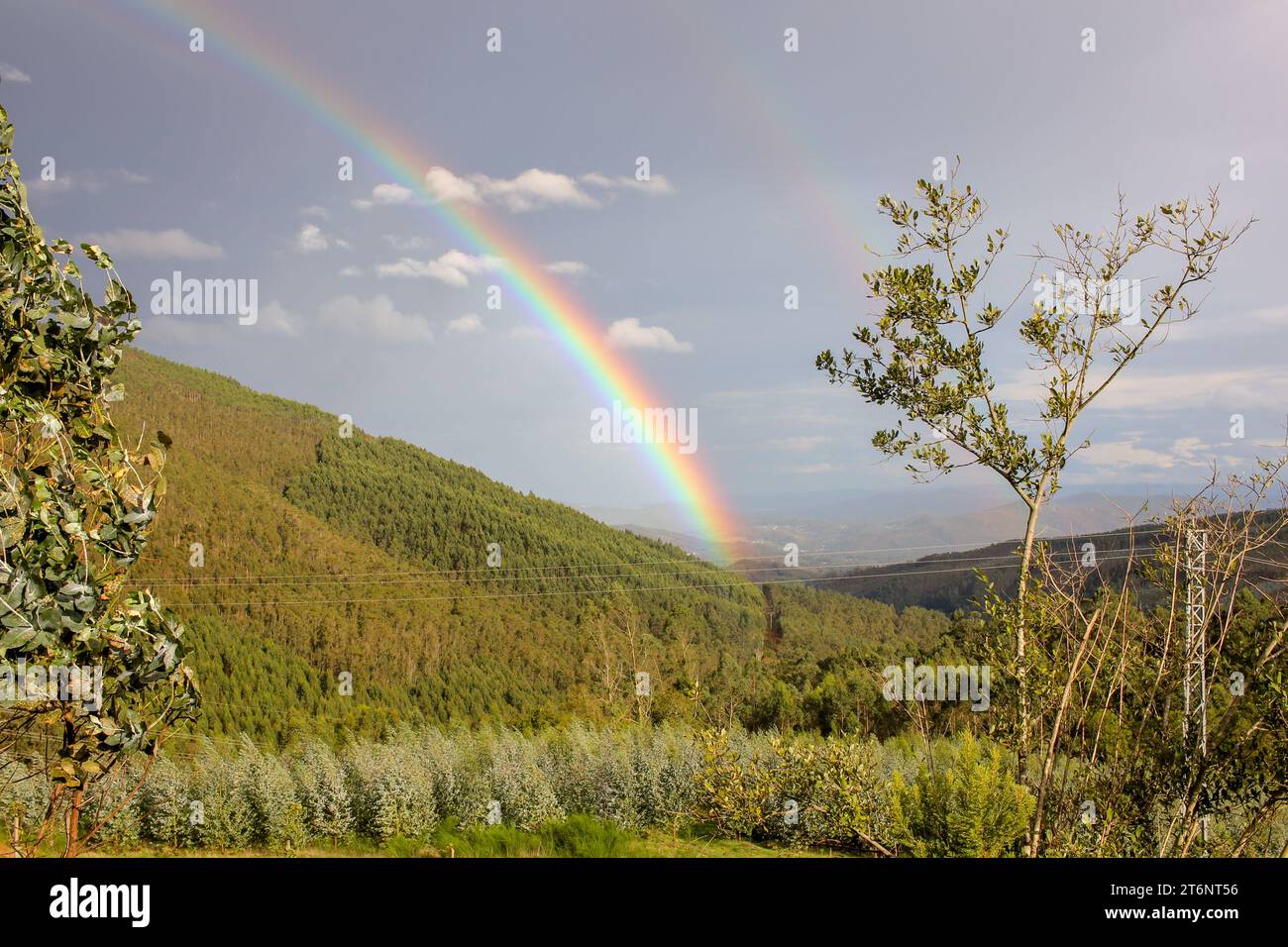 Rainbow between two mountains hi-res stock photography and images - Alamy