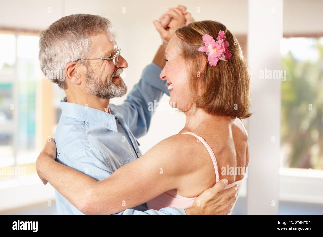 Senior couple, dancing and happy in house, love and ballroom for fun ...