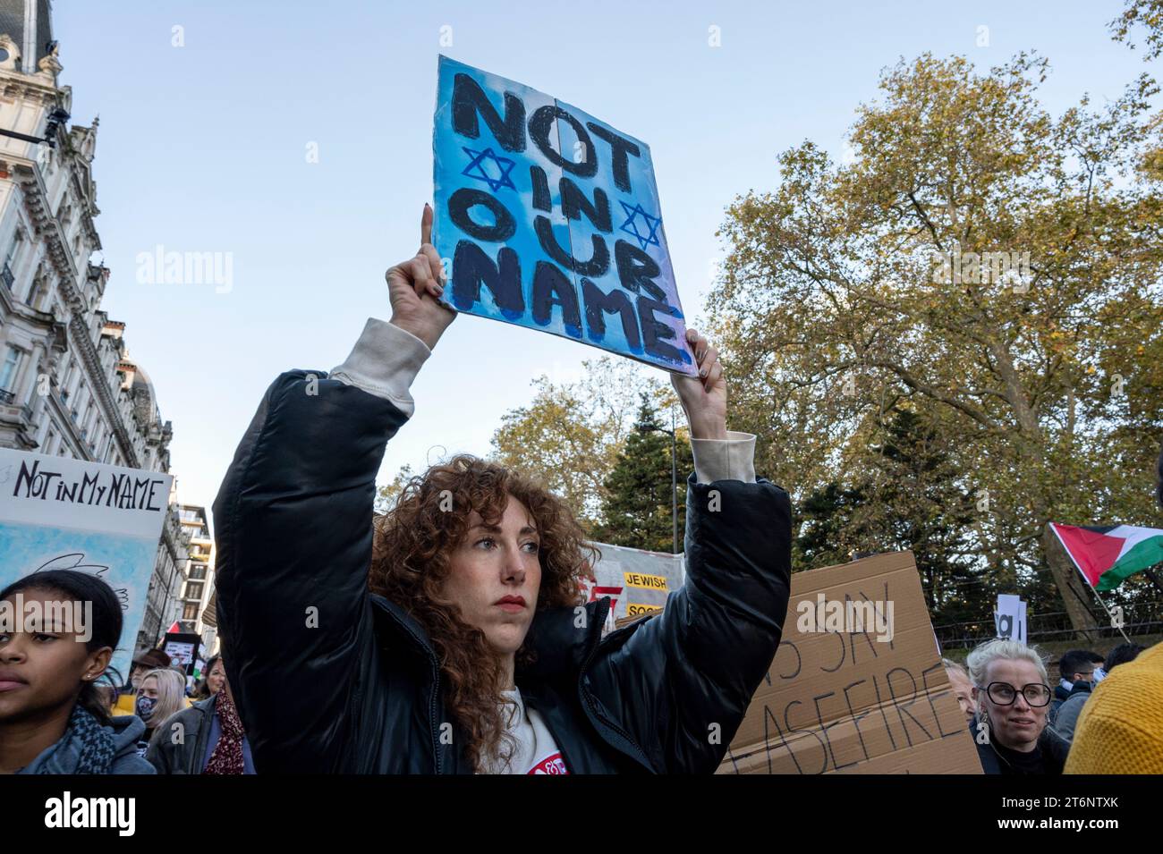 Stop the War on Gaza protest. A young woman with a placard "Not in Our ...