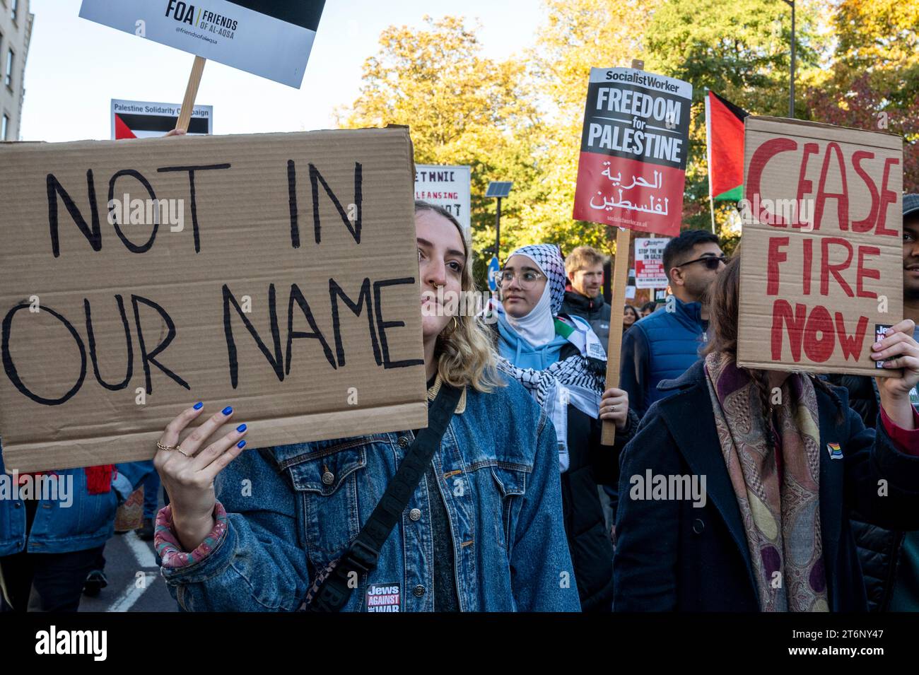 Protestors with placards "Not in our name" and Ceasefire now". London ...