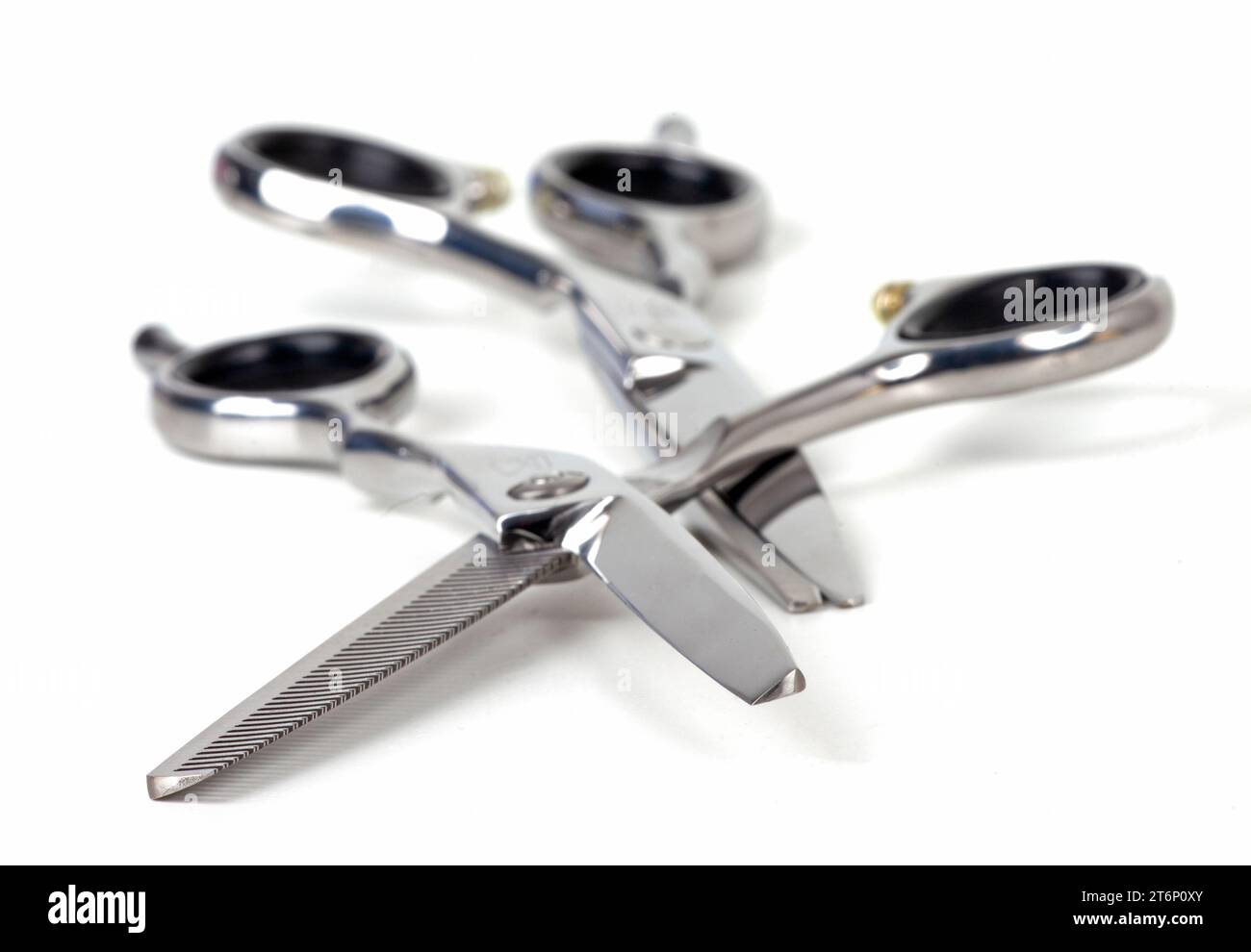 Barber cutting hair scissors comb Cut Out Stock Images & Pictures - Alamy