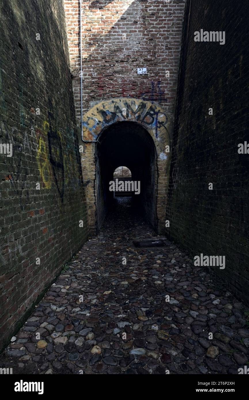 Entrance to a small underpass in an italian town Stock Photo - Alamy