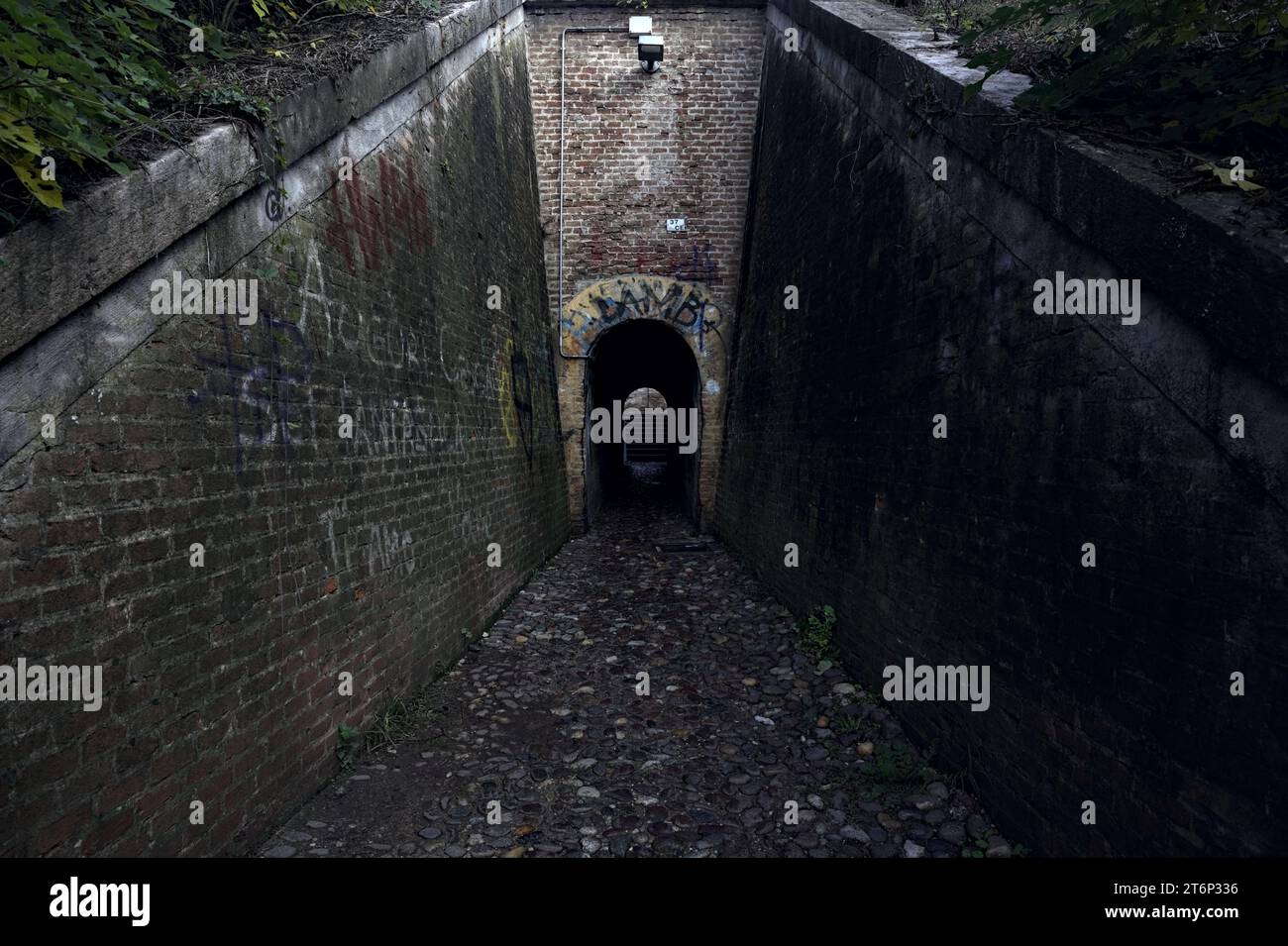Entrance to a small underpass in an italian town Stock Photo - Alamy