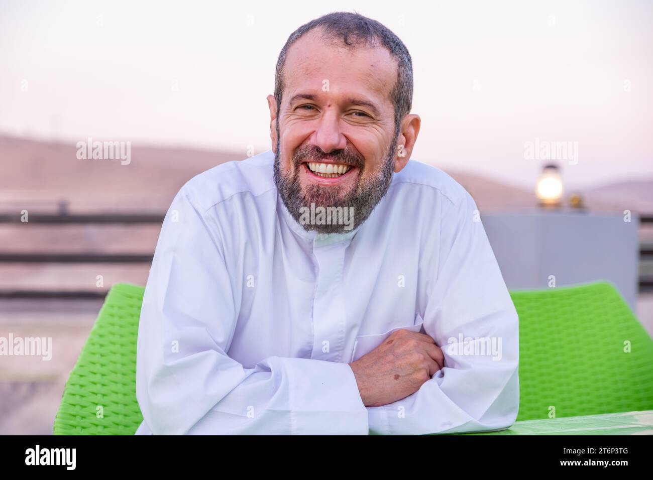 Portrait of arabian old arabian man sitting on chair have facial ...