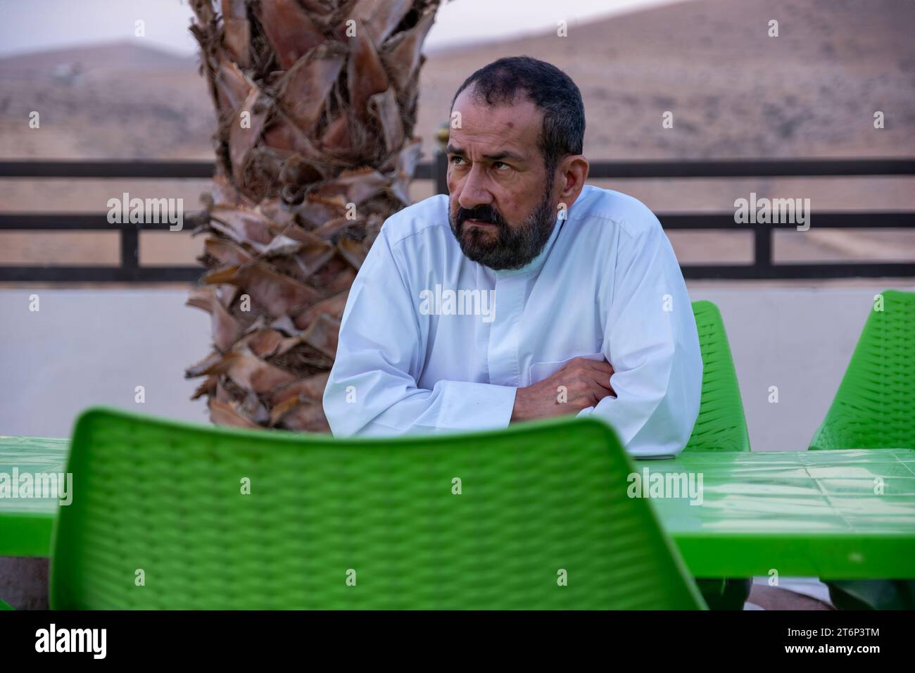 Portrait of arabian old arabian man sitting on chair have facial ...