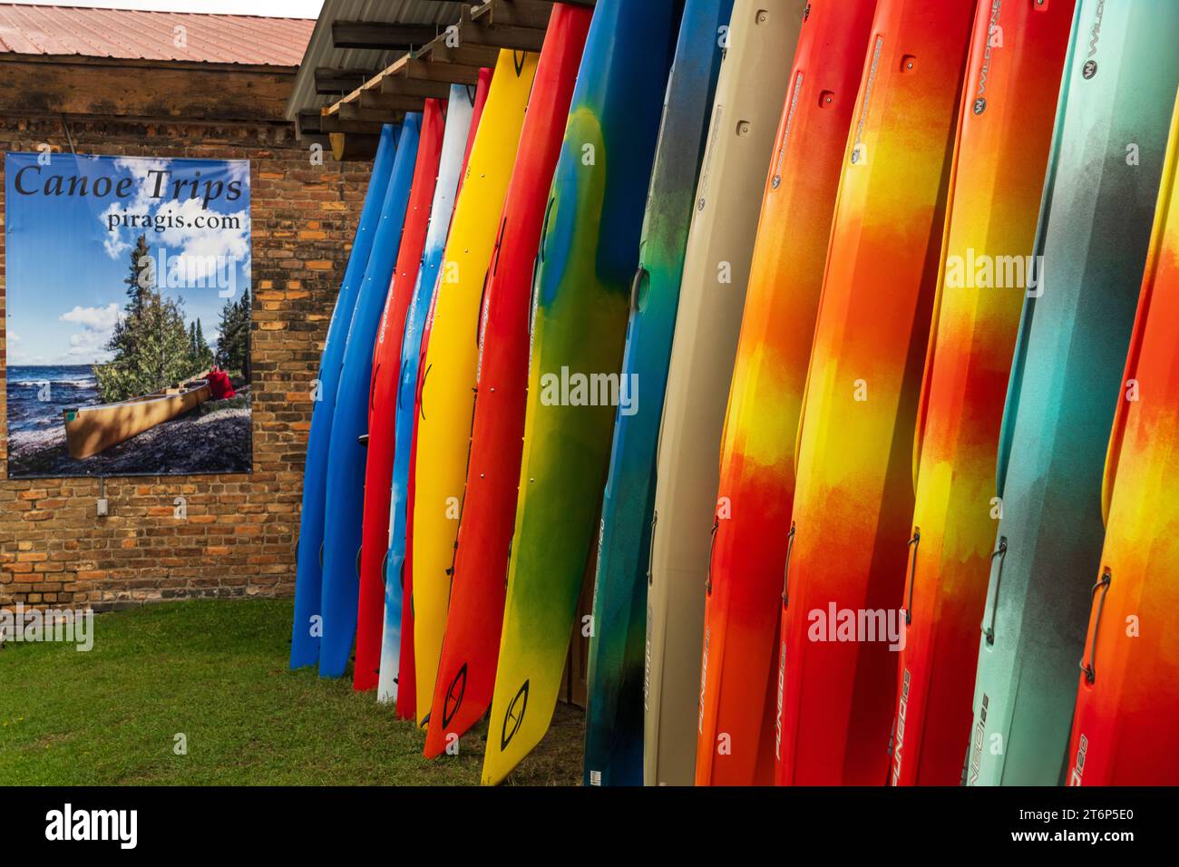 Colorful kayaks at an outdoor adventure shop in Ely, Minnesota, USA ...