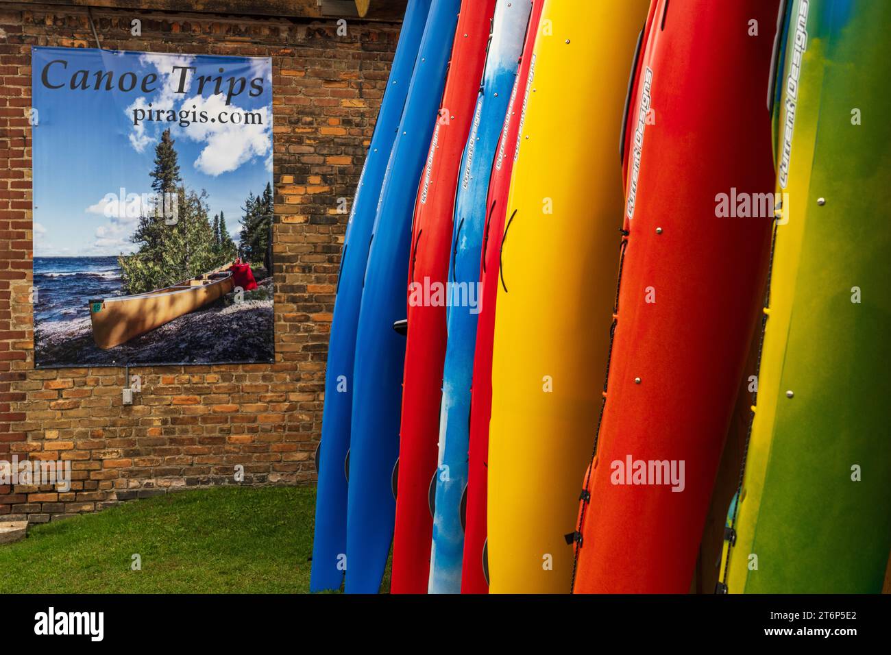 Colorful kayaks at an outdoor adventure shop in Ely, Minnesota, USA ...