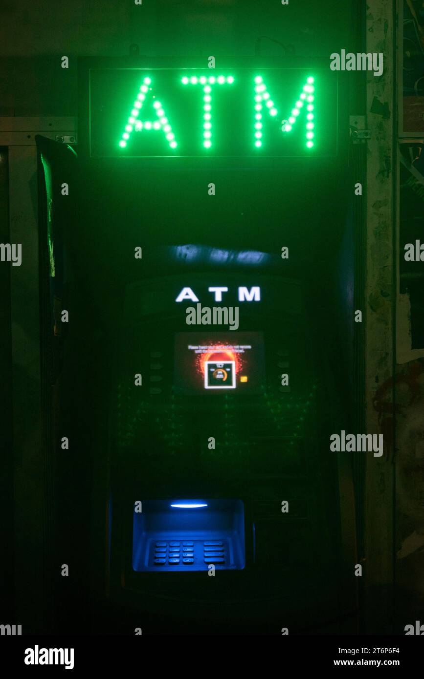 Atm neon lights changing money sign Stock Photo - Alamy
