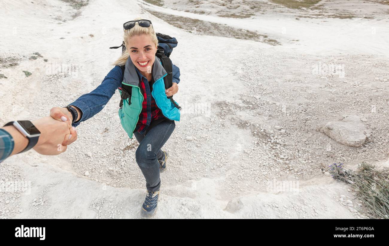 Beautiful woman climbing mountain Stock Photo - Alamy