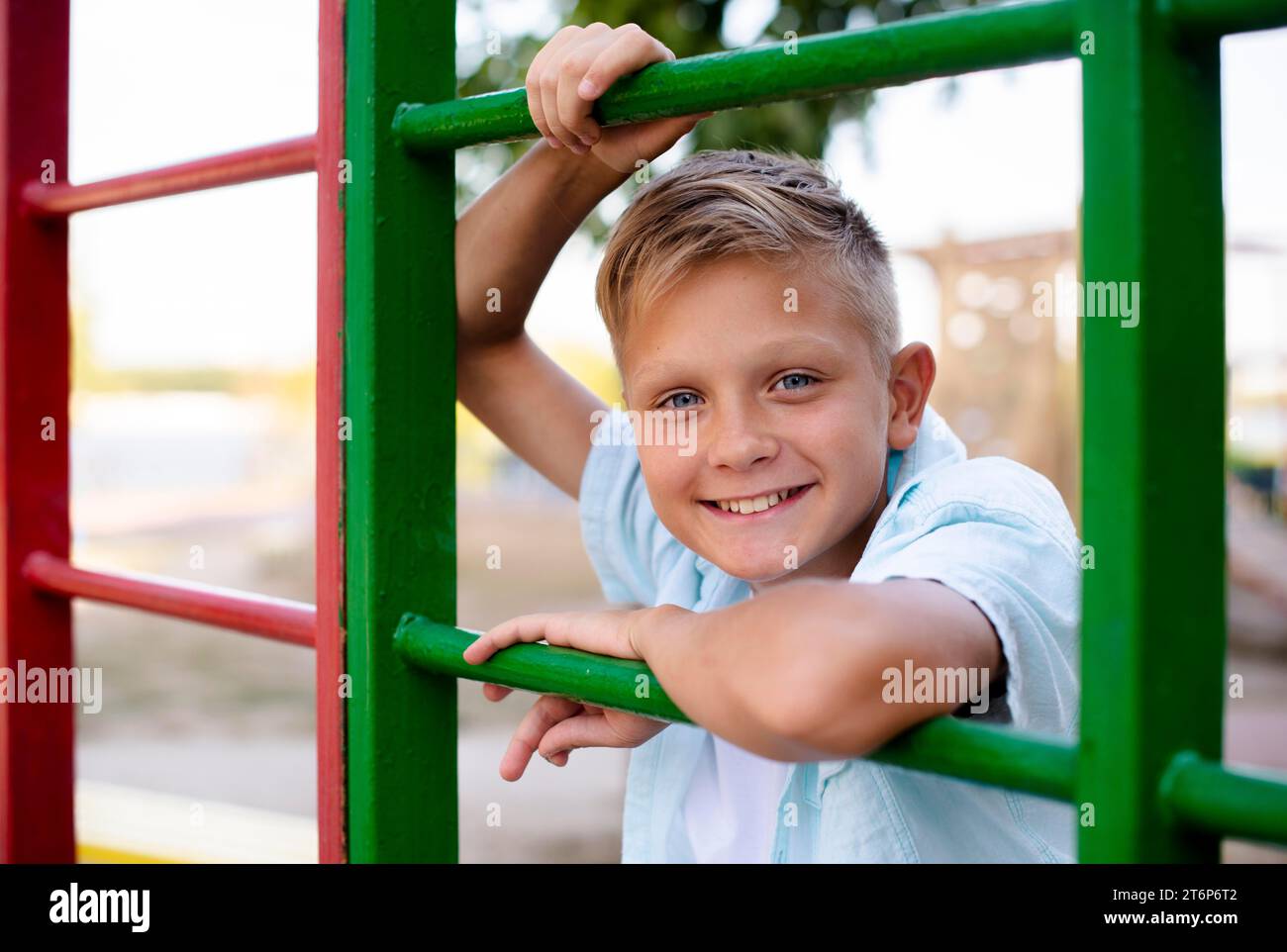 Cheerful boy playing alone playground Stock Photo - Alamy