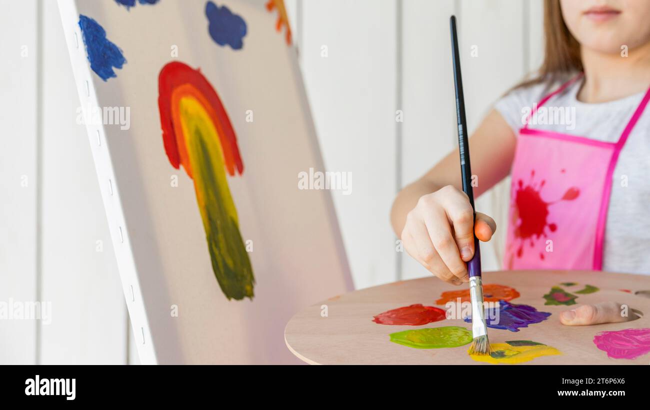 Girl with paint brush hi-res stock photography and images - Alamy
