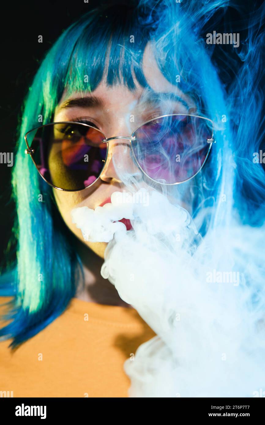 Front view female dj with sunglasses smoking Stock Photo - Alamy