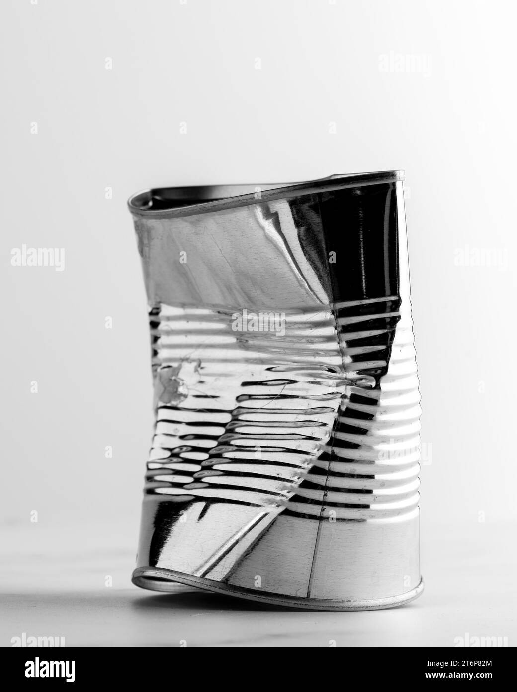 Front vire crushed tall tin can Stock Photo - Alamy
