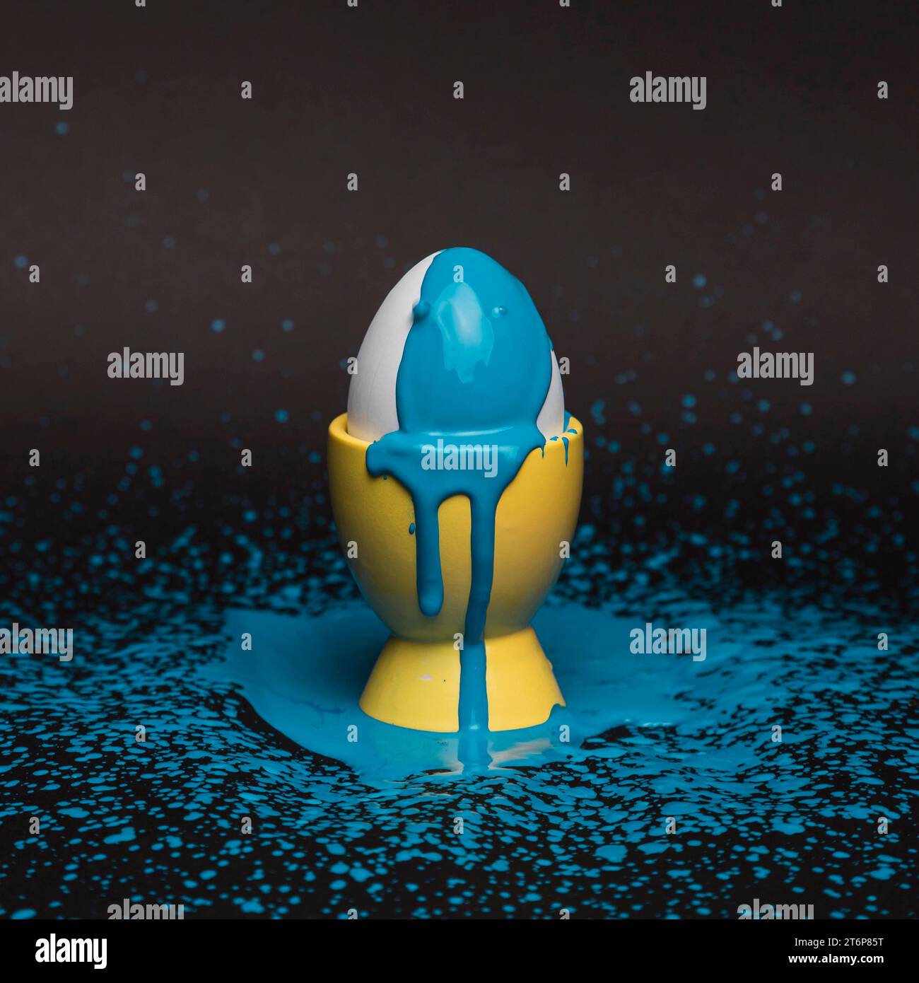 High angle egg support with blue paint Stock Photo - Alamy