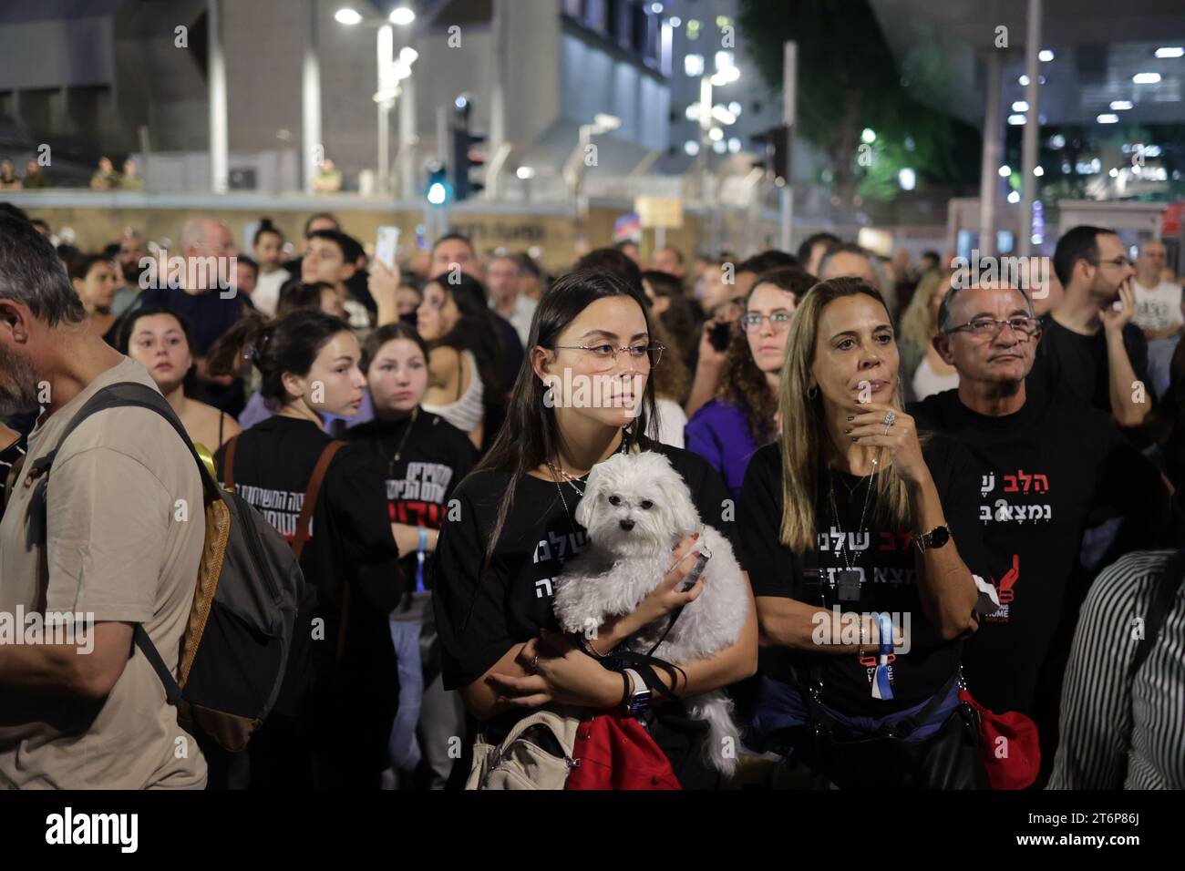 11 November 2023, Israel, Tel Aviv: A woman carries her dog during a ...