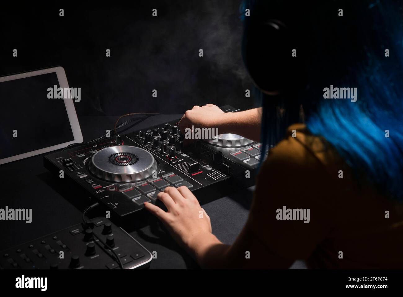 High angle female dj mixing panel Stock Photo - Alamy
