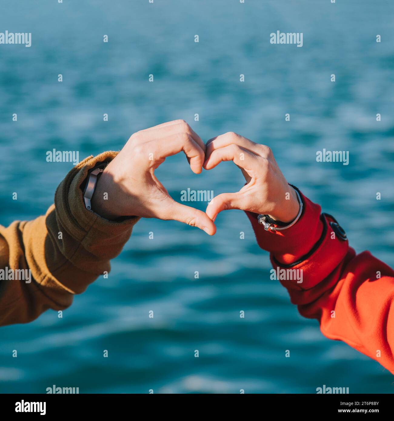 Loving couple holding hands heart shape Stock Photo - Alamy