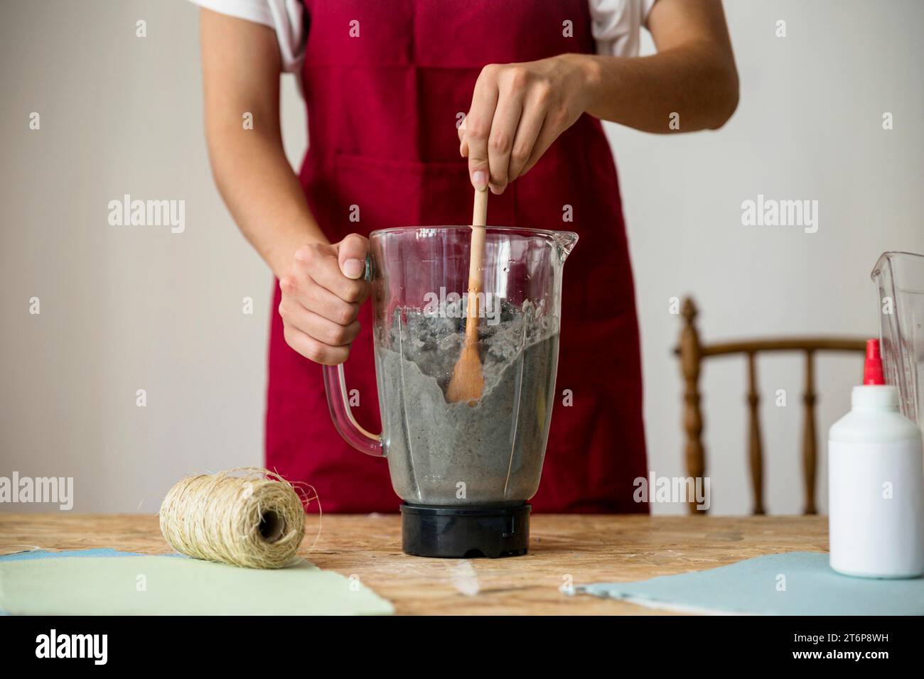 Midsection view woman s hand stirring paper pulp blender Stock Photo ...