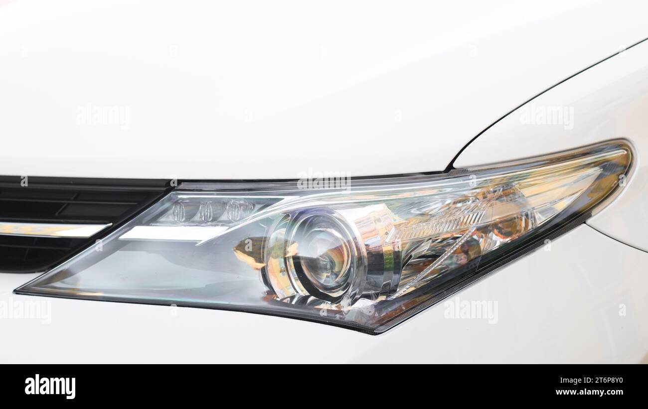 Modern led headlight white car Stock Photo - Alamy