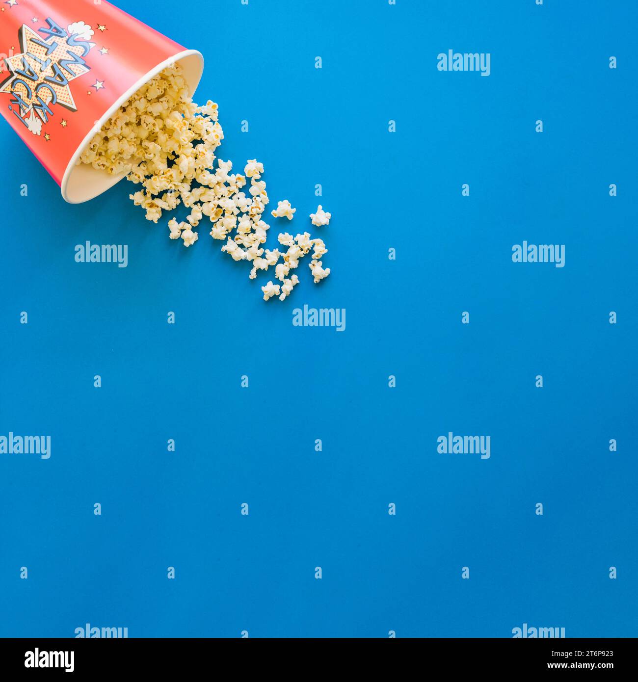 Popcorn blue background with space right Stock Photo - Alamy