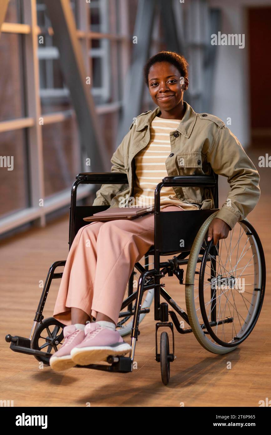 Portrait smiley student wheelchair Stock Photo - Alamy