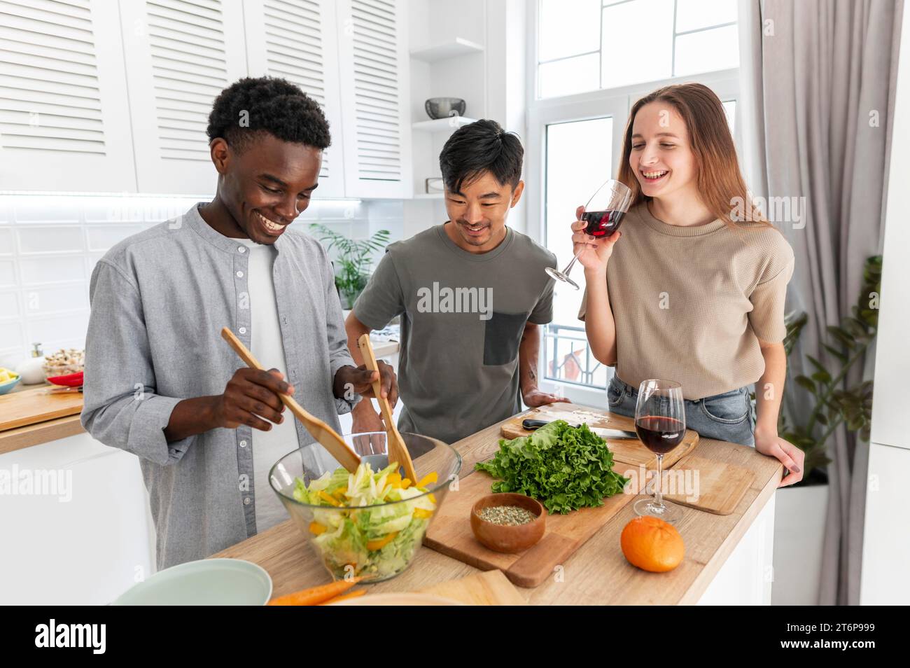 Roommates eating together medium shot Stock Photo - Alamy