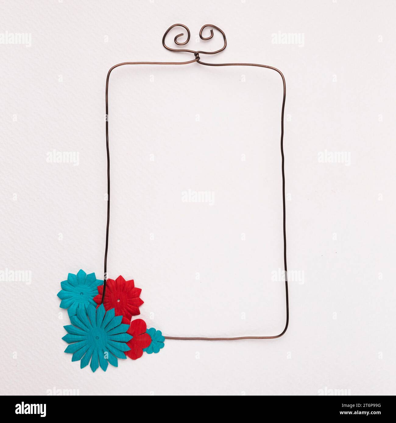 Red blue flower corner wired rectangular frame against white backdrop ...