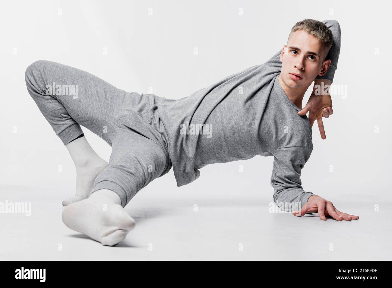 Side view male dancer tracksuit socks posing Stock Photo - Alamy